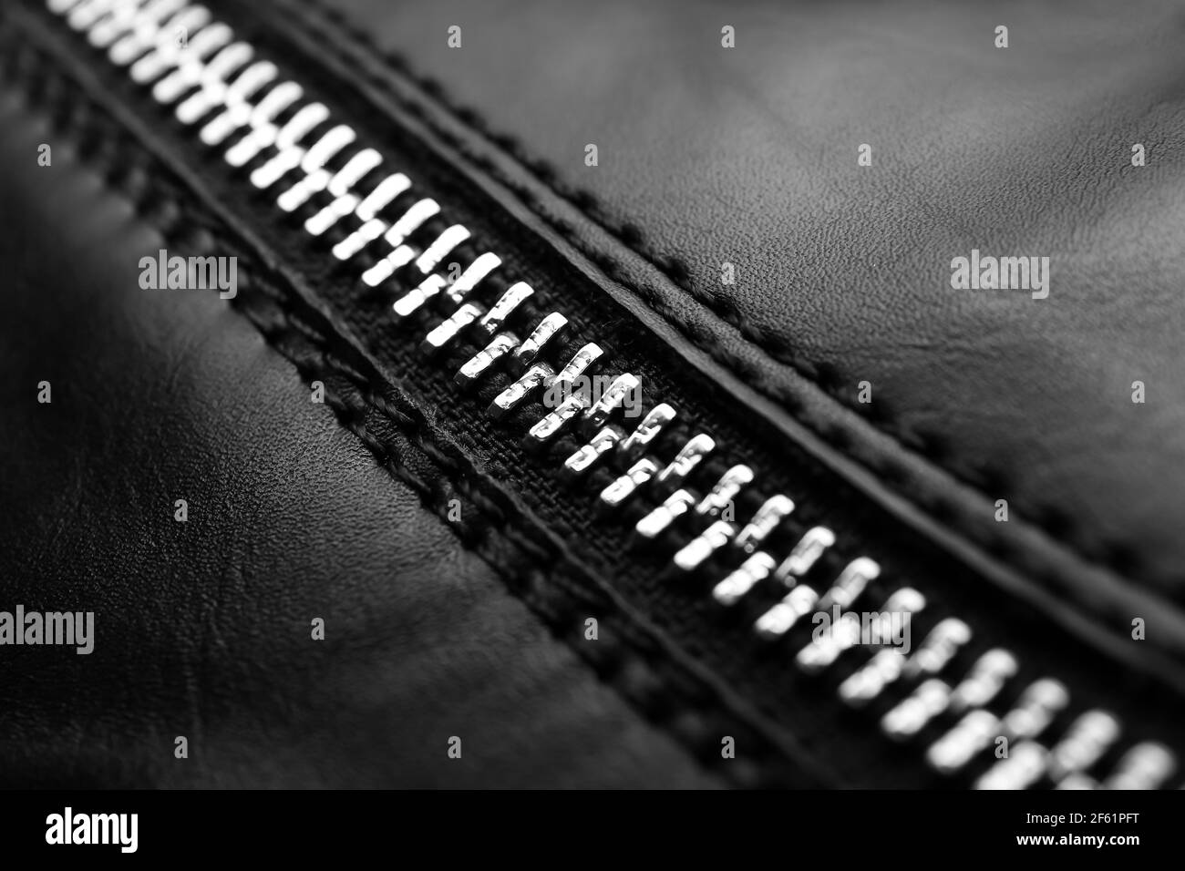 Black leather texture with metal zipper, closeup Stock Photo - Alamy