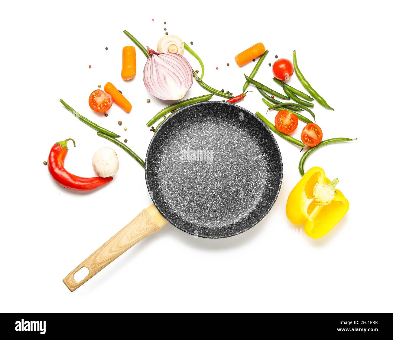 Composition with frying pan and different vegetables on white ...