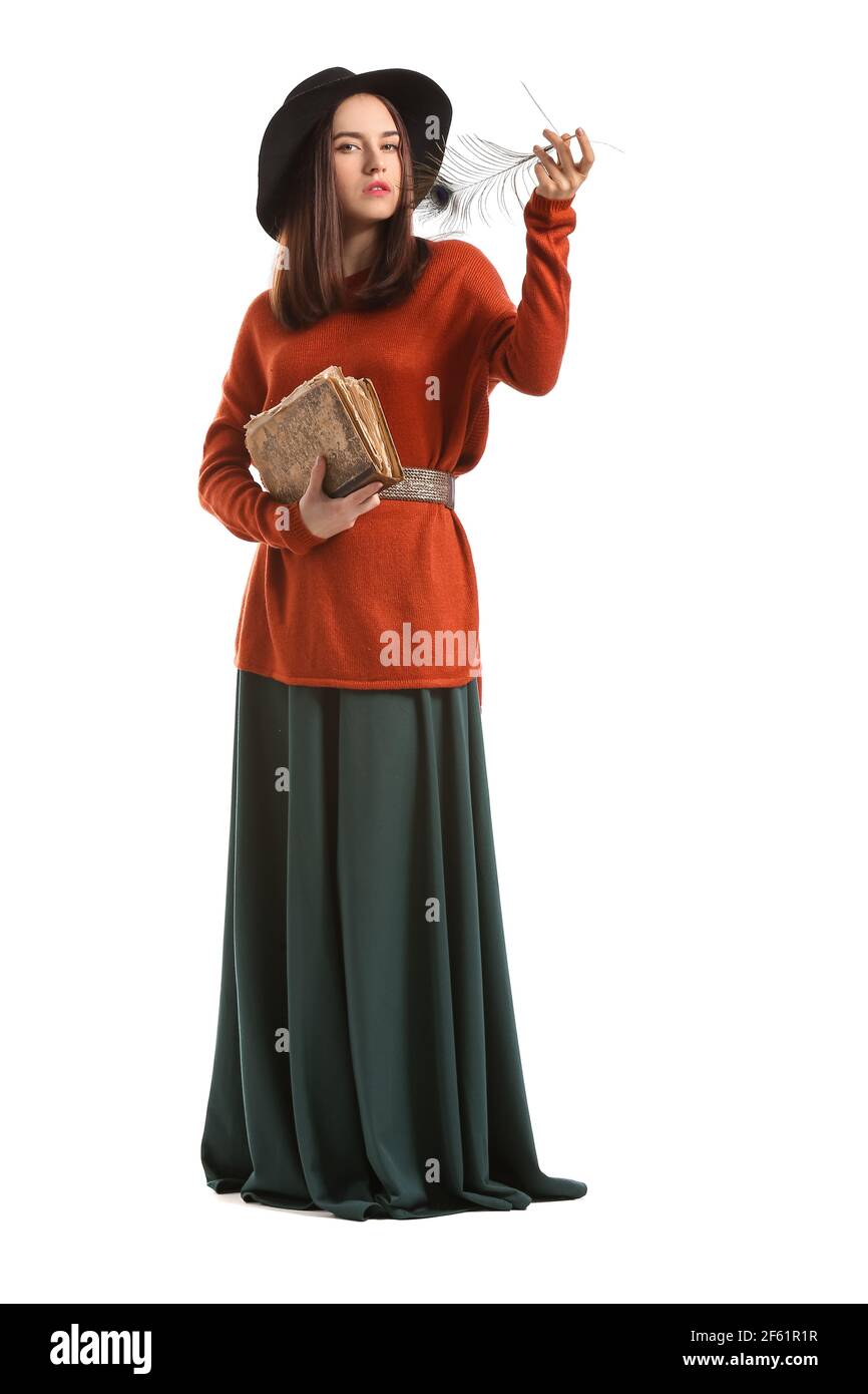 Female fortune teller with book on white background Stock Photo - Alamy