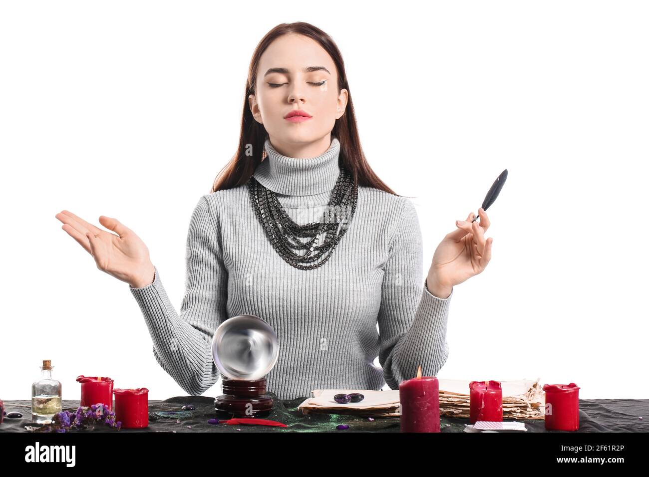 Female fortune teller on white background Stock Photo - Alamy