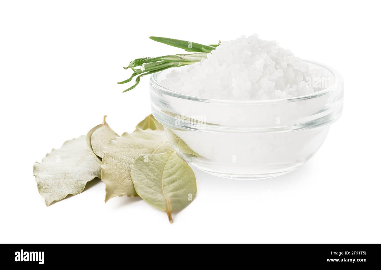 Bowl with salt, bay leaves and rosemary on white background Stock Photo ...