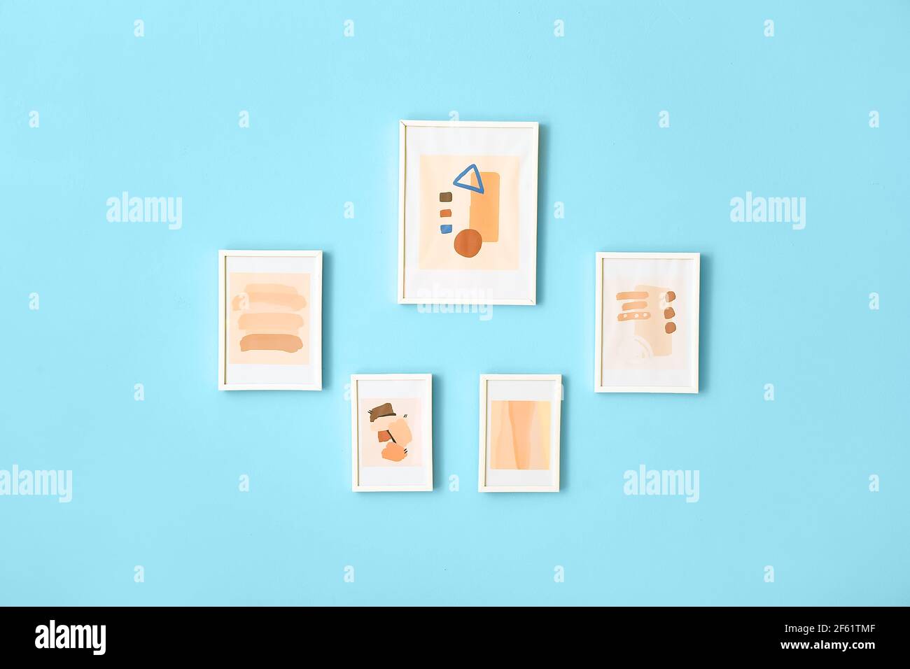 Beautiful pictures hanging on color wall Stock Photo - Alamy