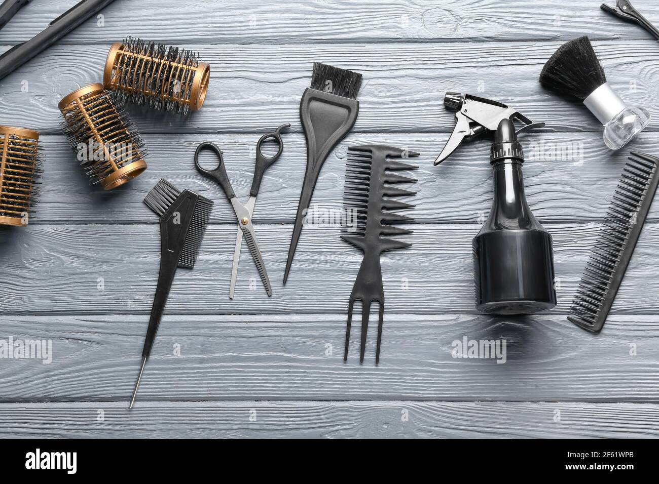 Set of hairdresser's tools on wooden background Stock Photo - Alamy