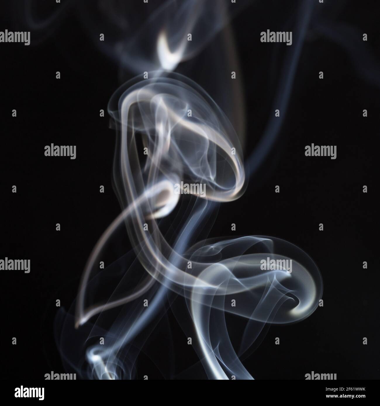 Cloud of smoke on black background Stock Photo - Alamy