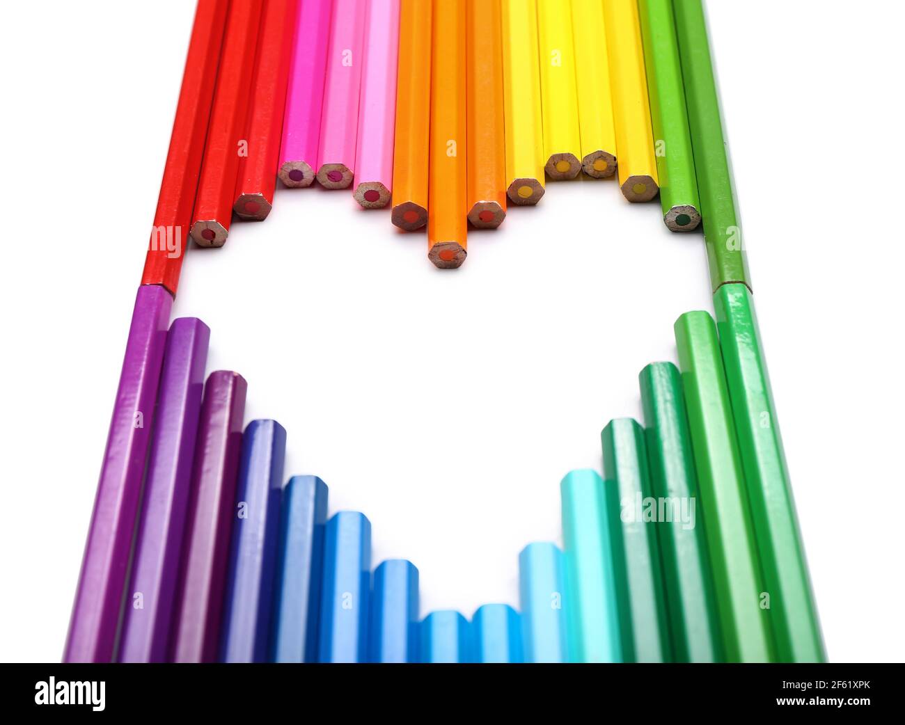 Heart shape made of colorful pencils on white background Stock Photo ...