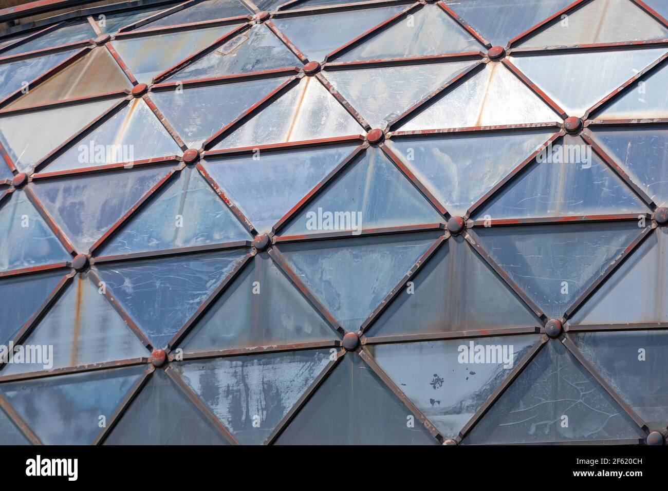 Blue Triangular Glass Windows at Oval Building Stock Photo - Alamy
