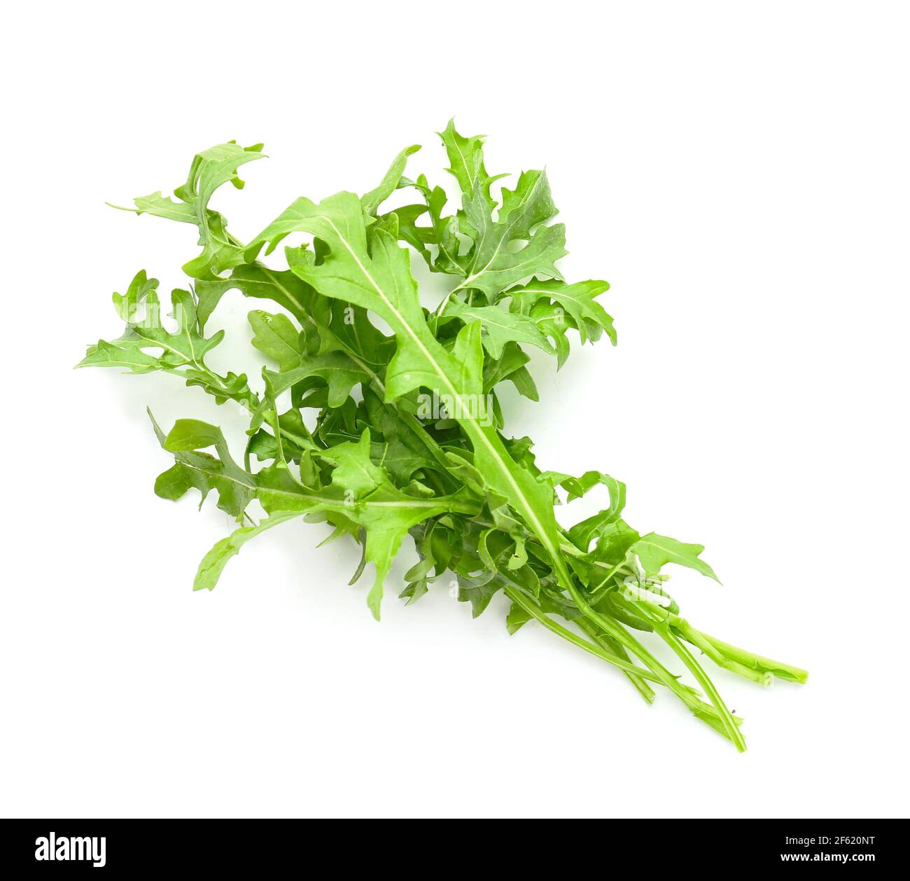 Heap of fresh arugula on white background Stock Photo - Alamy