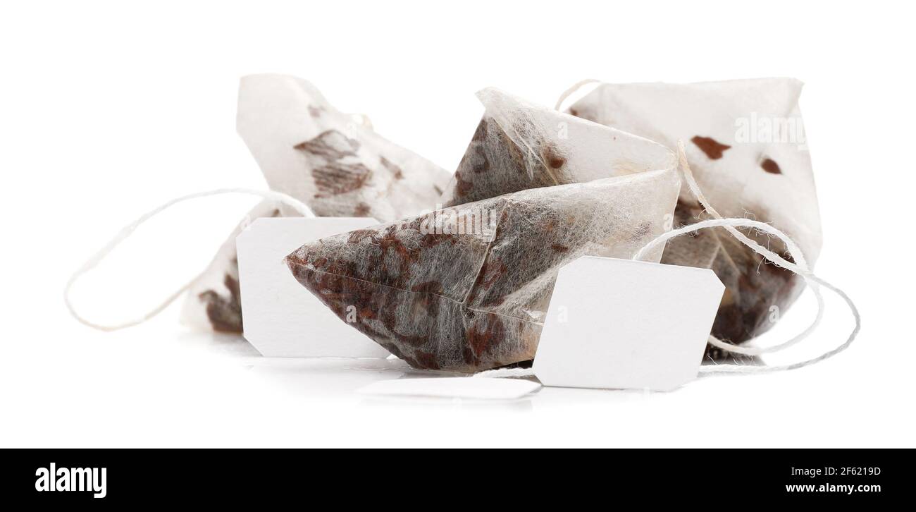 Used tea bags on white background Stock Photo - Alamy
