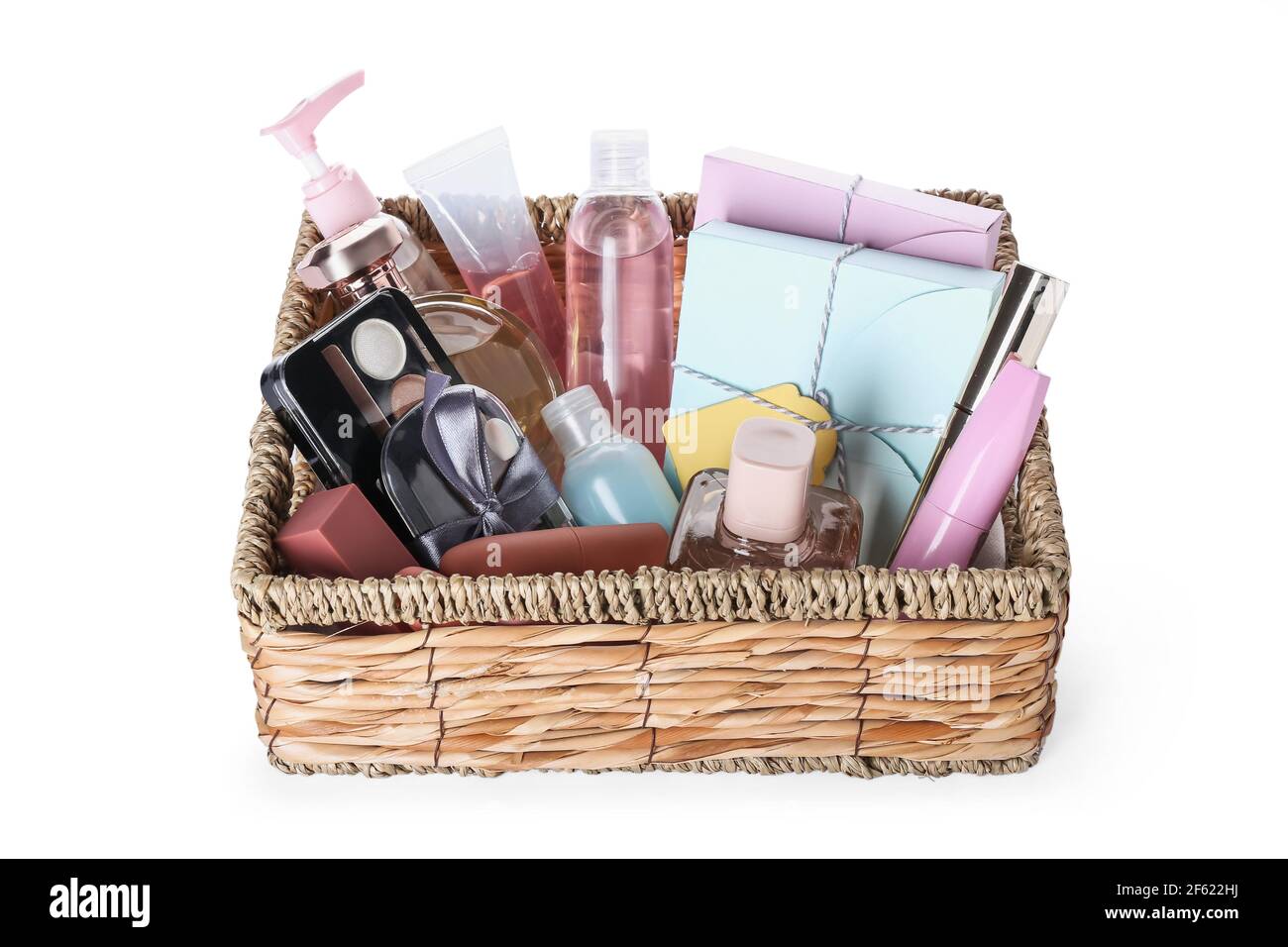 Gift basket with cosmetics on white background Stock Photo - Alamy