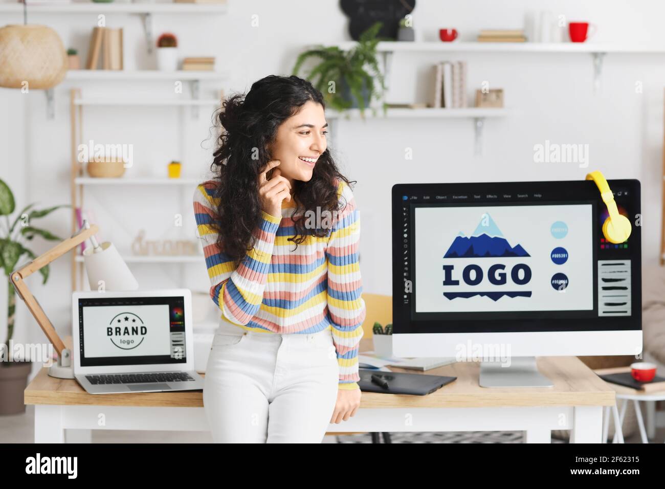 Graphic designer working in office Stock Photo - Alamy