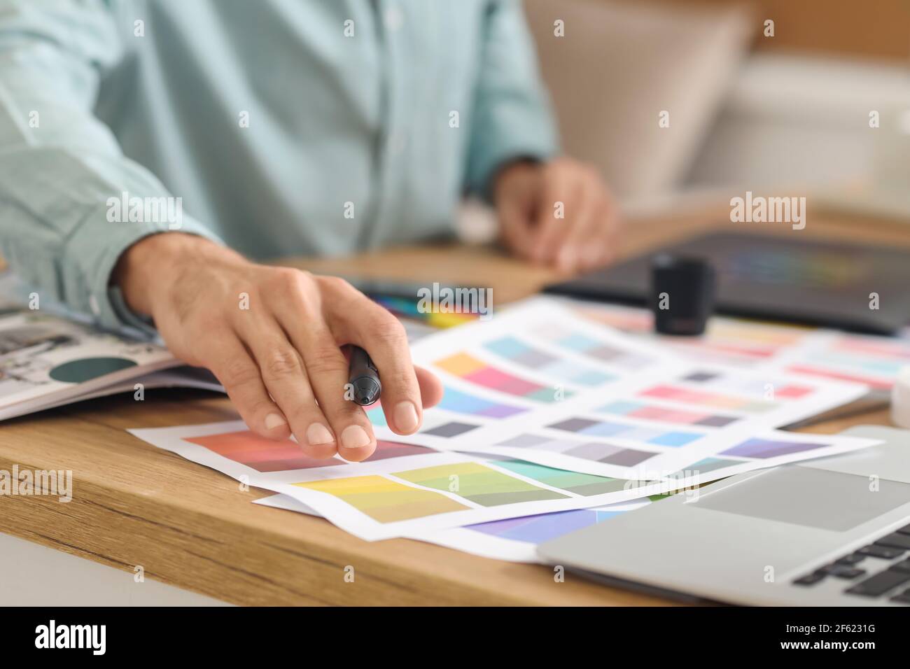 Graphic designer working in office, closeup Stock Photo - Alamy