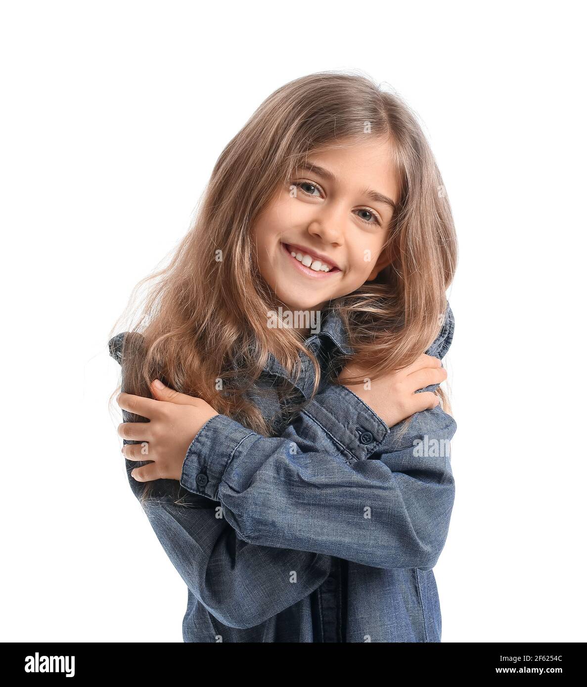 Little girl embracing herself on white background Stock Photo - Alamy