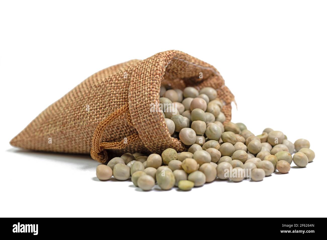Dried peas in a burlap sack against a white background Stock Photo - Alamy