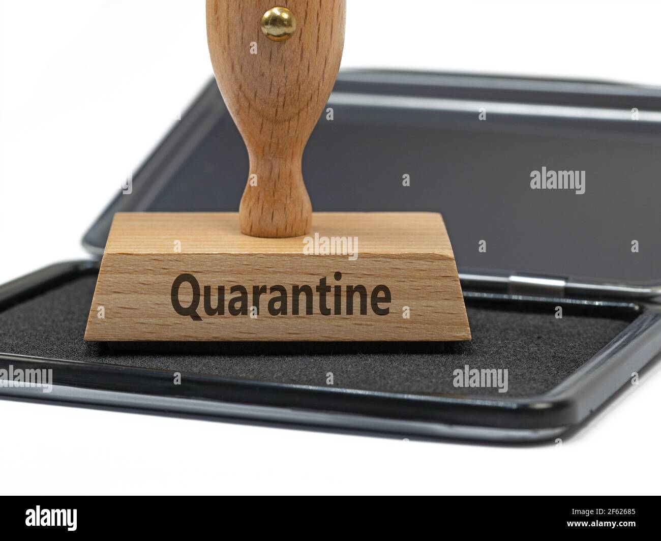 Wooden stamp with the inscription "Quarantine Stock Photo - Alamy