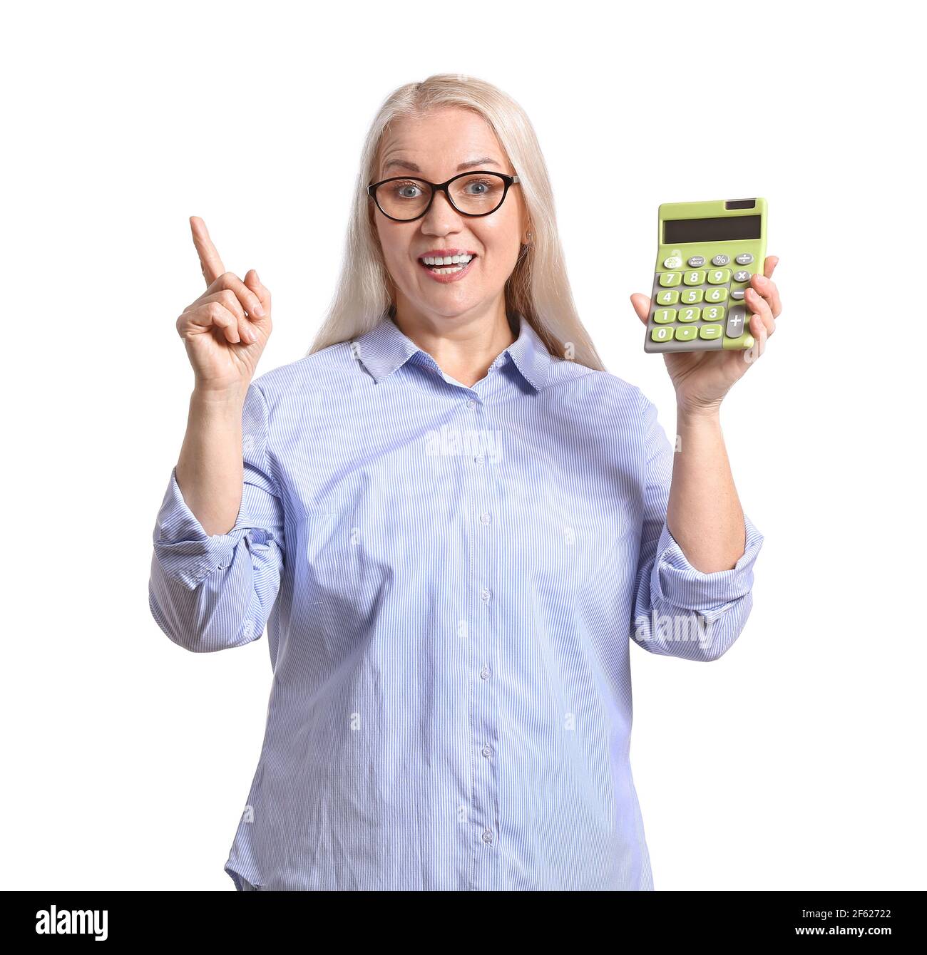 Mature woman with calculator on white background Stock Photo - Alamy