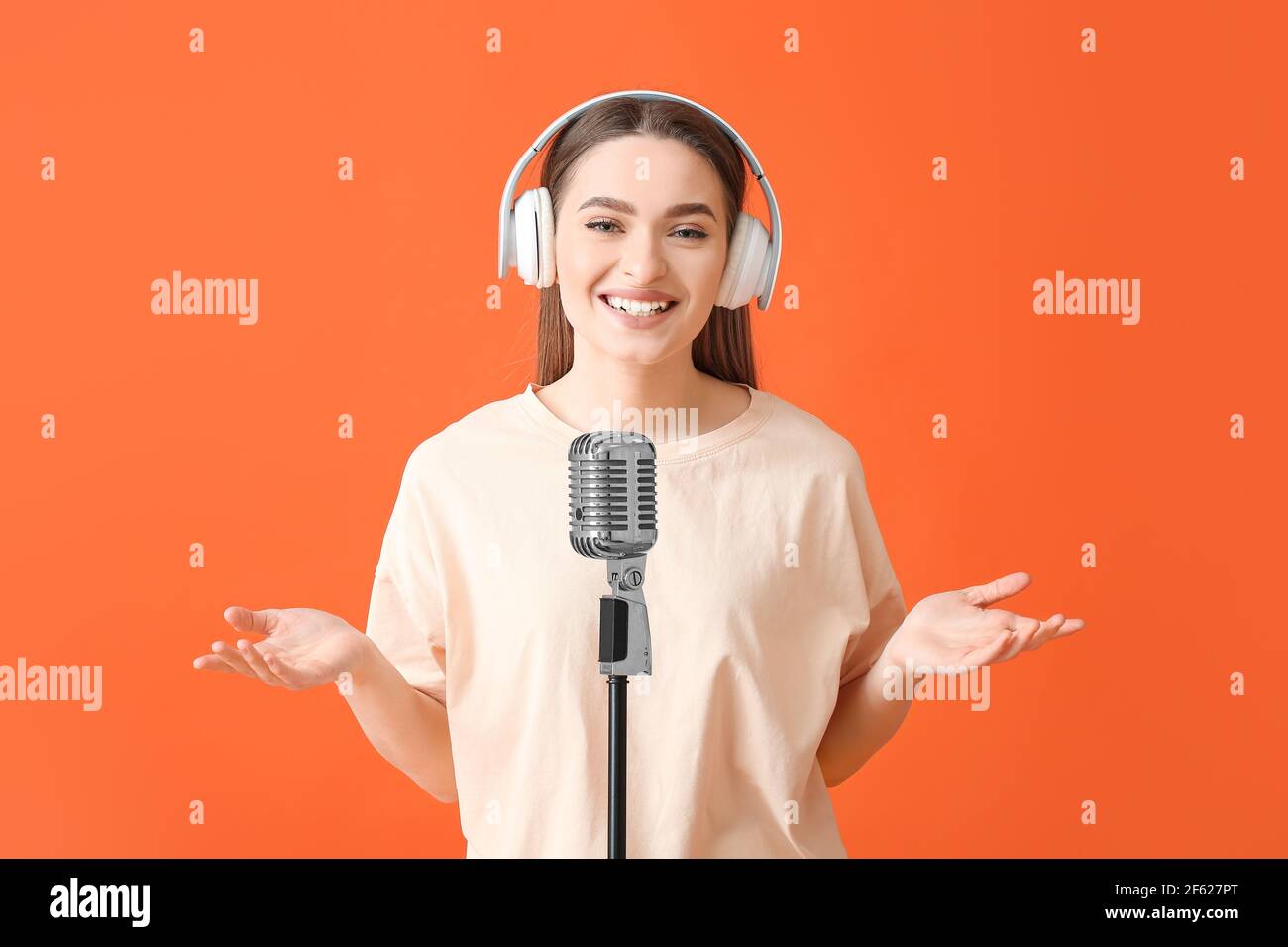 Female radio presenter with microphone on color background Stock Photo ...