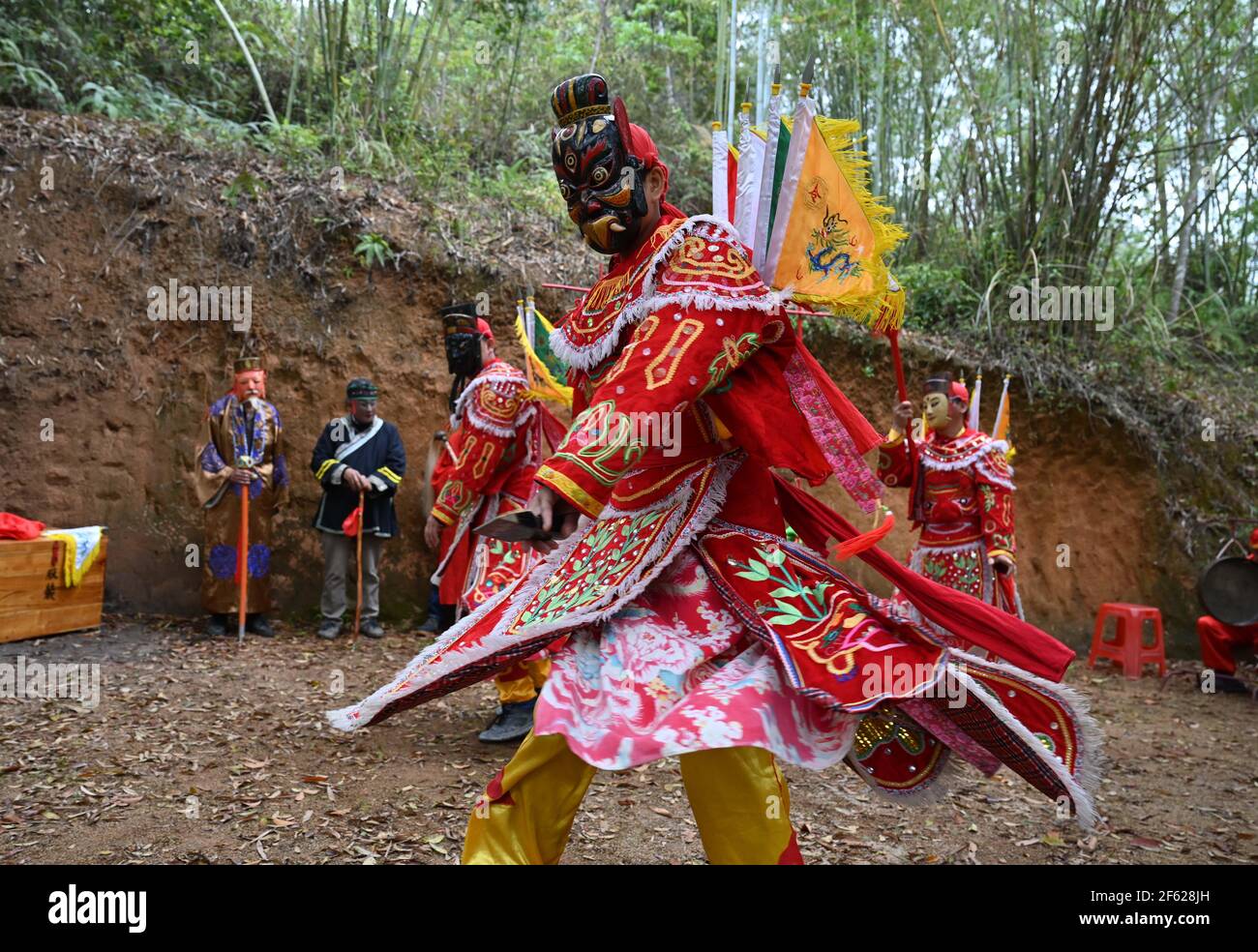 The farmers are dancing the traditional Nuo opera to pray for harvest in Qinzhou,Guangxi,China ...