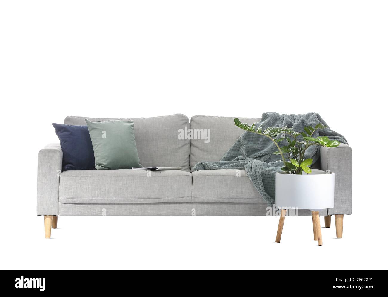 Stylish sofa with table on white background Stock Photo - Alamy