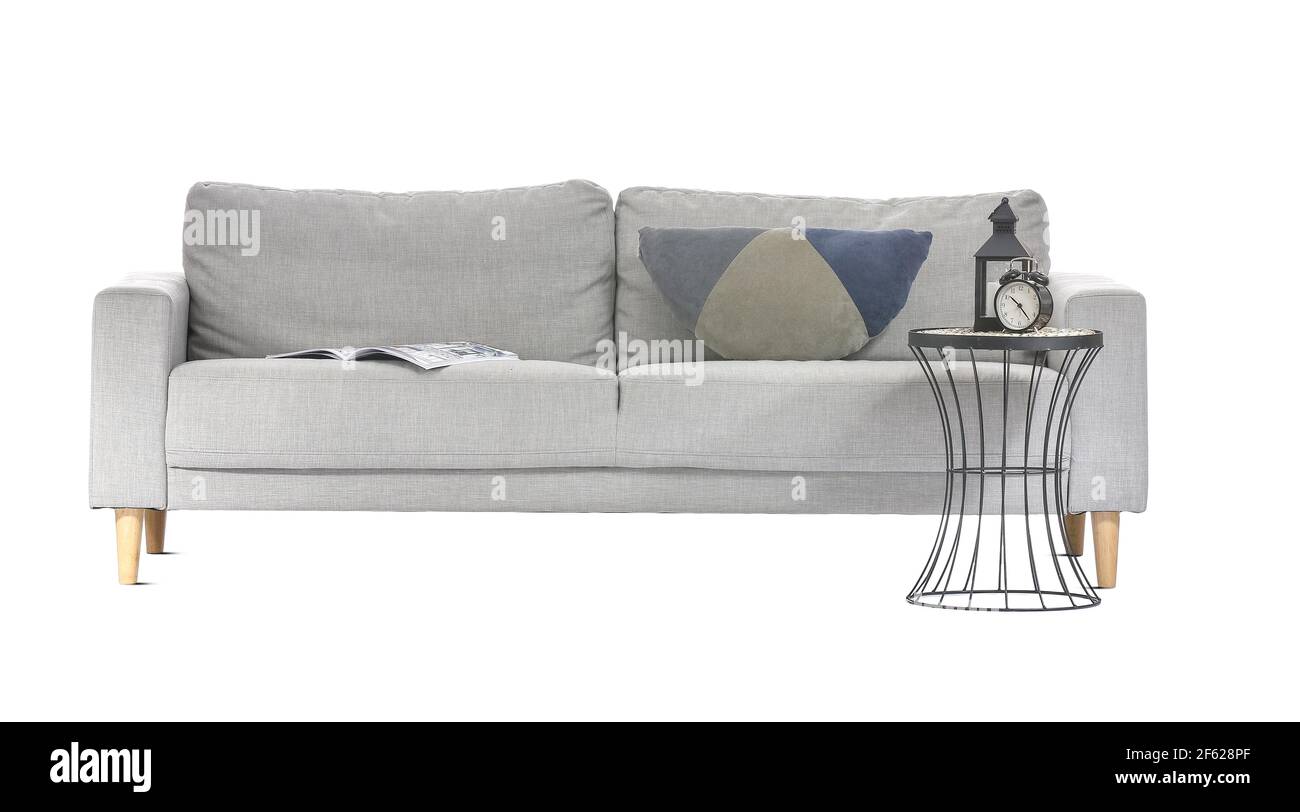 Stylish sofa with table on white background Stock Photo - Alamy