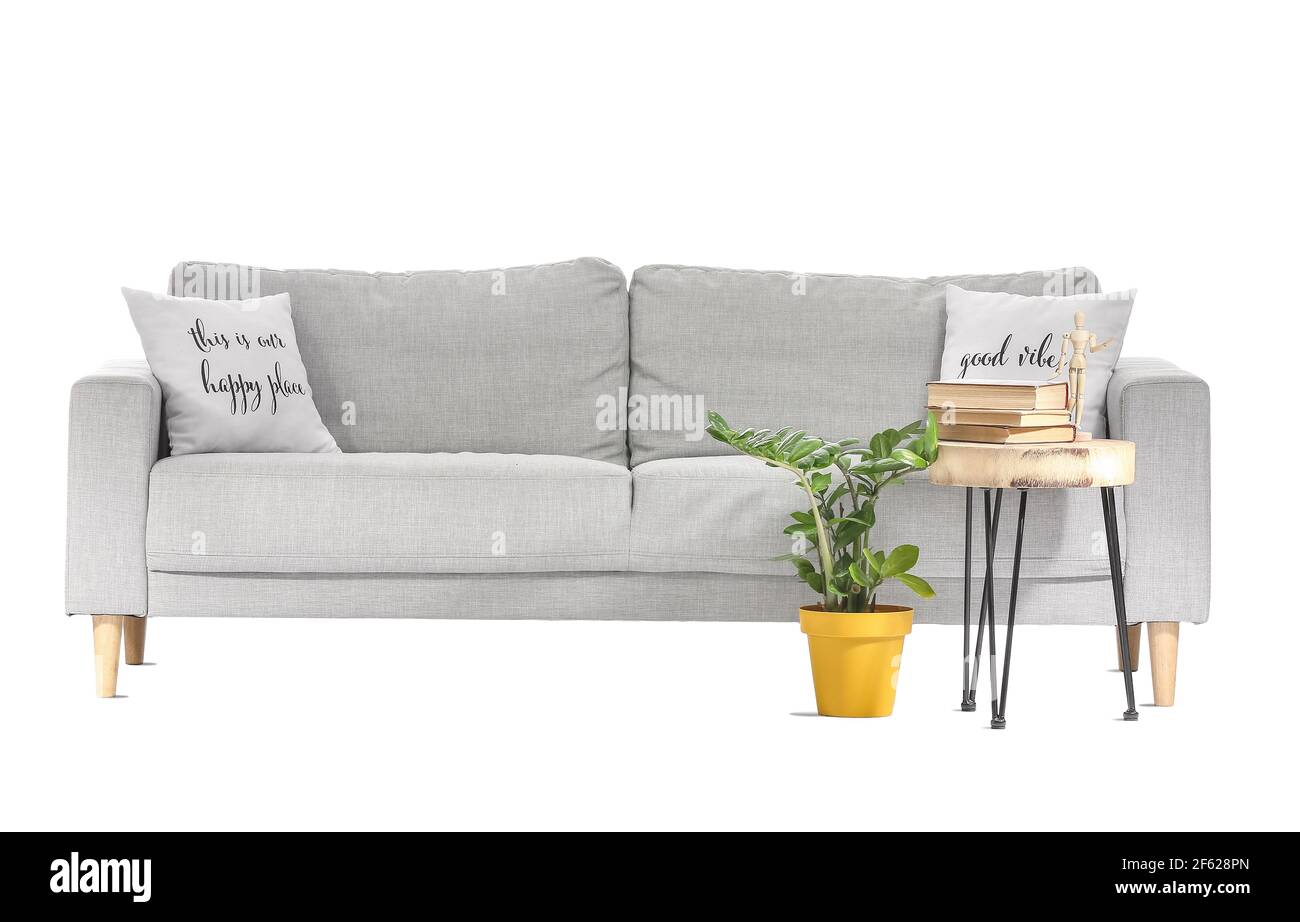 Stylish sofa with table on white background Stock Photo - Alamy