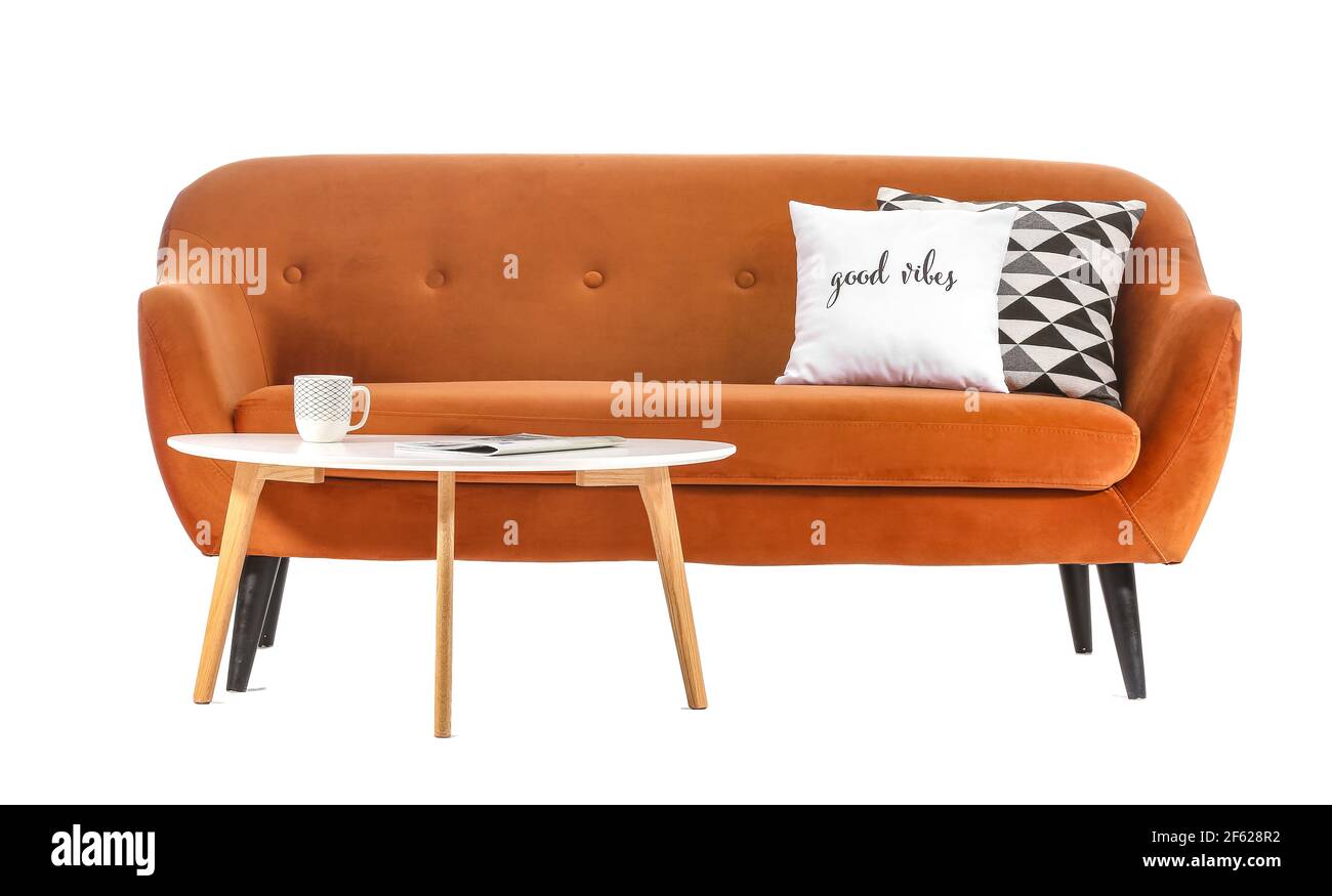 Stylish sofa with table on white background Stock Photo - Alamy