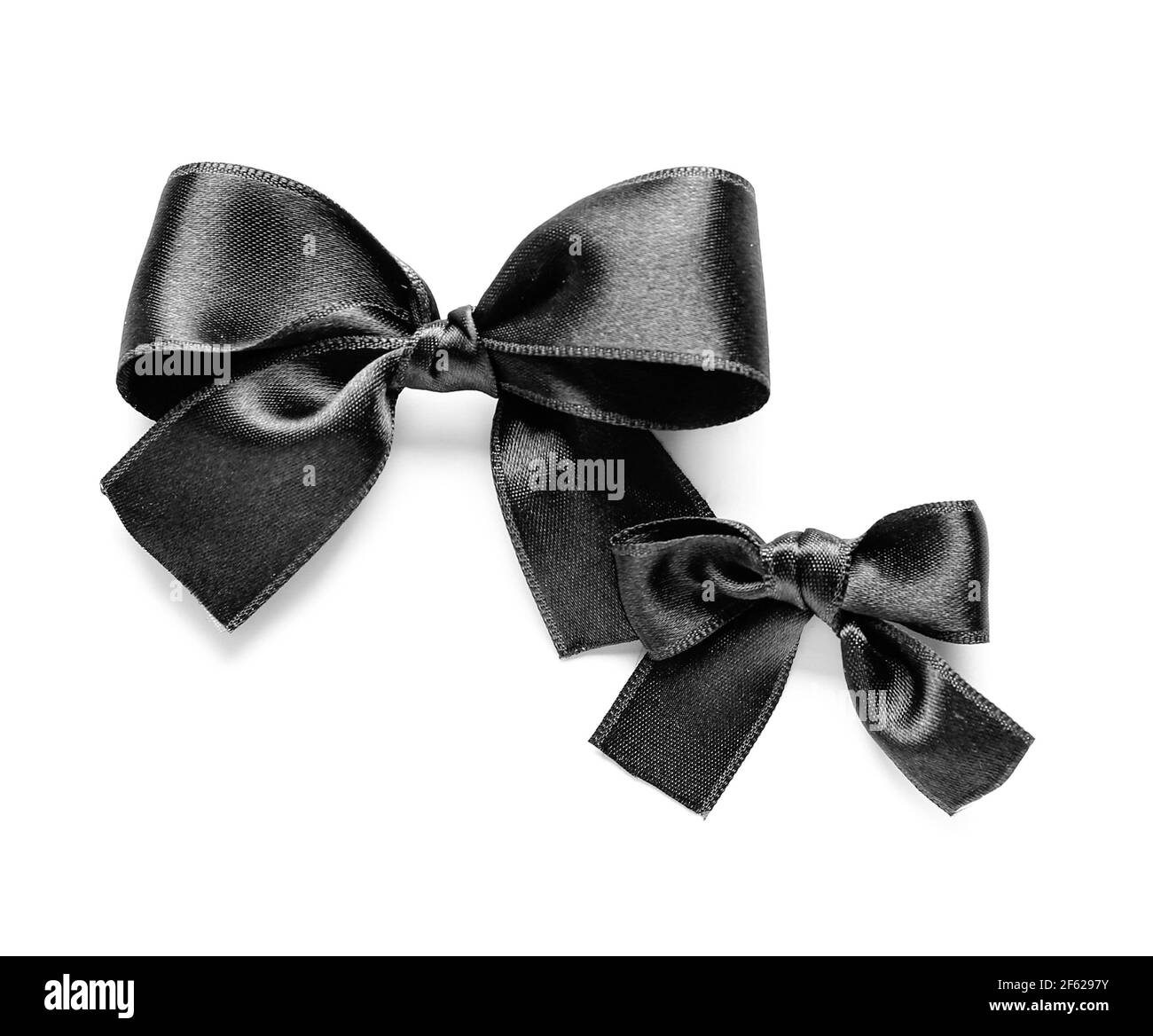 Black bows on white background Stock Photo - Alamy