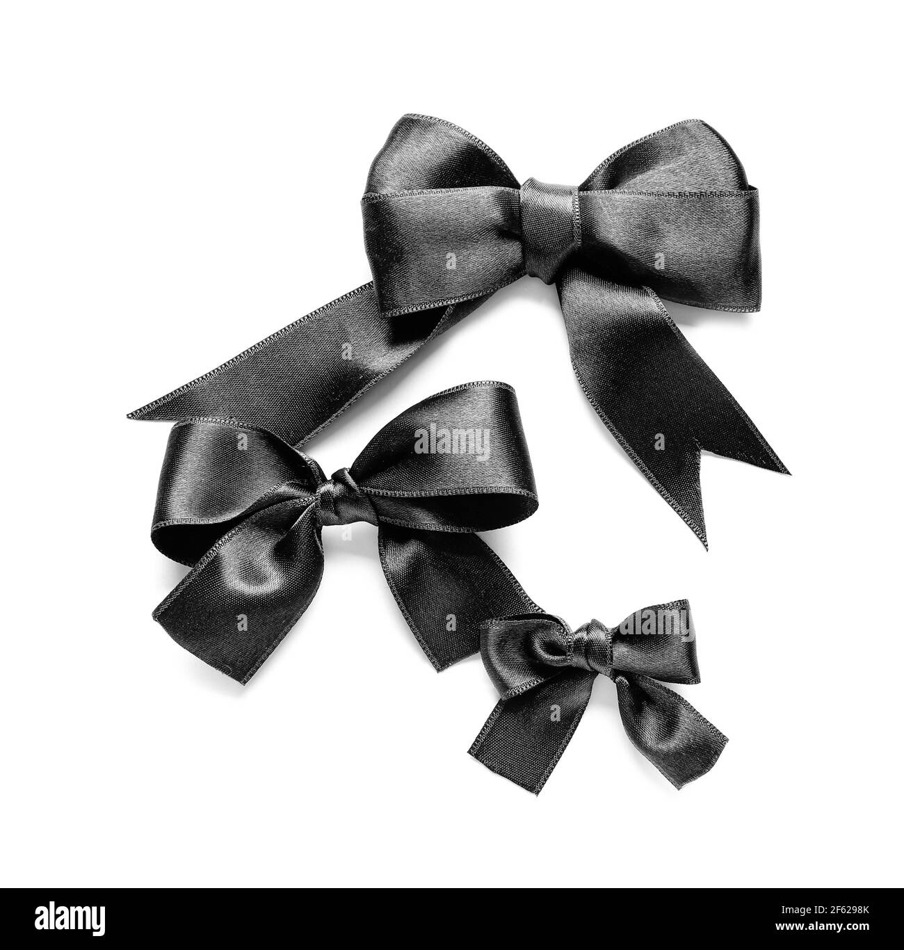 Black bows on white background Stock Photo - Alamy