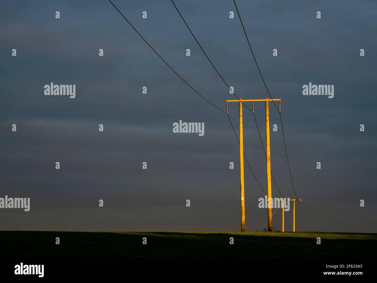 Electric power lines in autumn sunlight in the Worcestershire ...