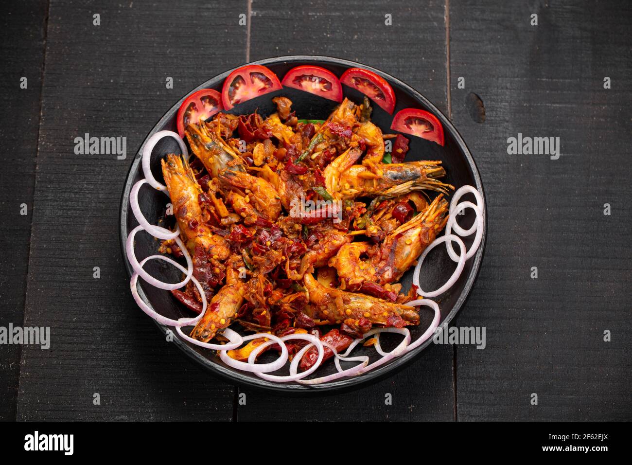 Kerala style Prawns roast or chemmeen varattiyathu made using red ...