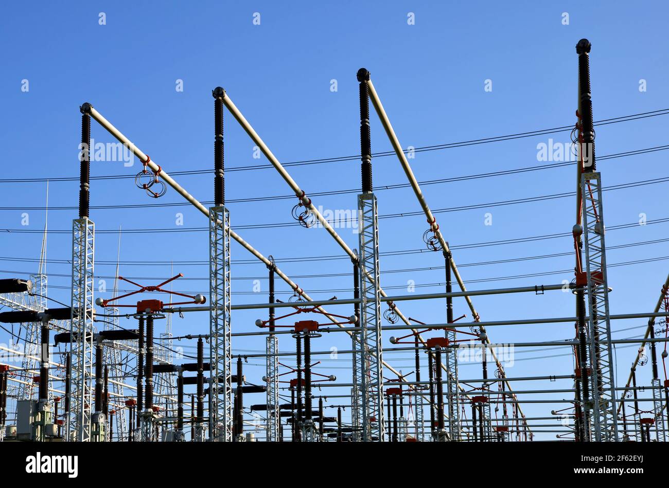 High voltage power substation on blue sky background Stock Photo - Alamy