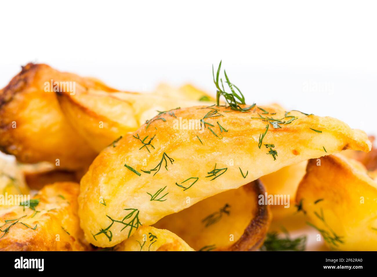 Baked potato wedges with minced dill. Macro. Photo can be used as a ...