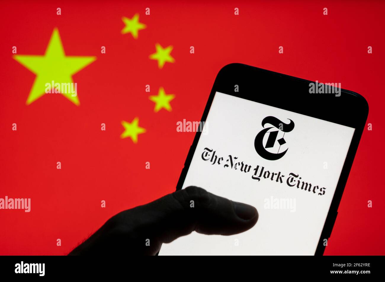 In this photo illustration the American newspaper The New York Times ...