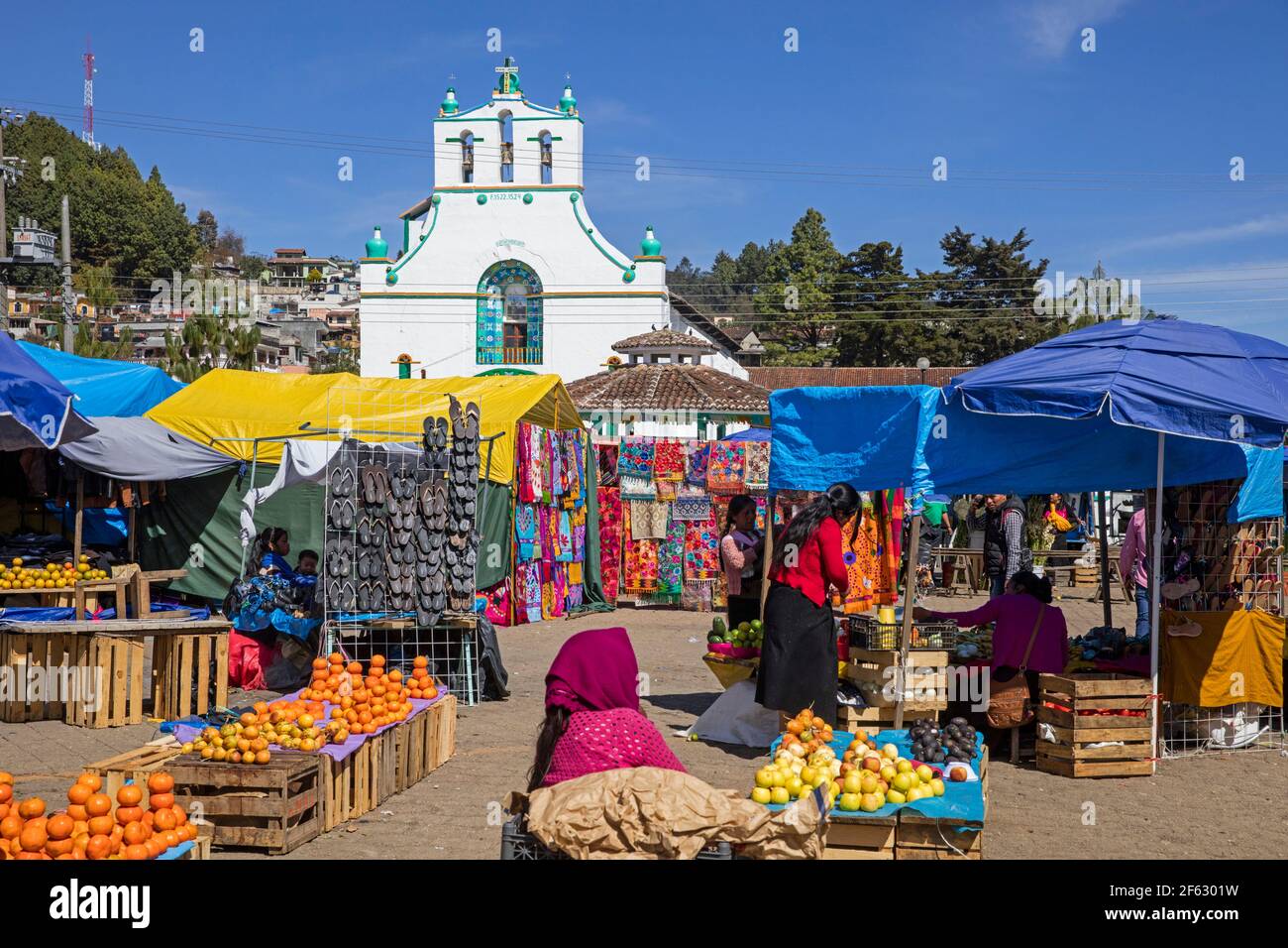 Market day in front of the Spanish colonial church of San Juan / Templo ...