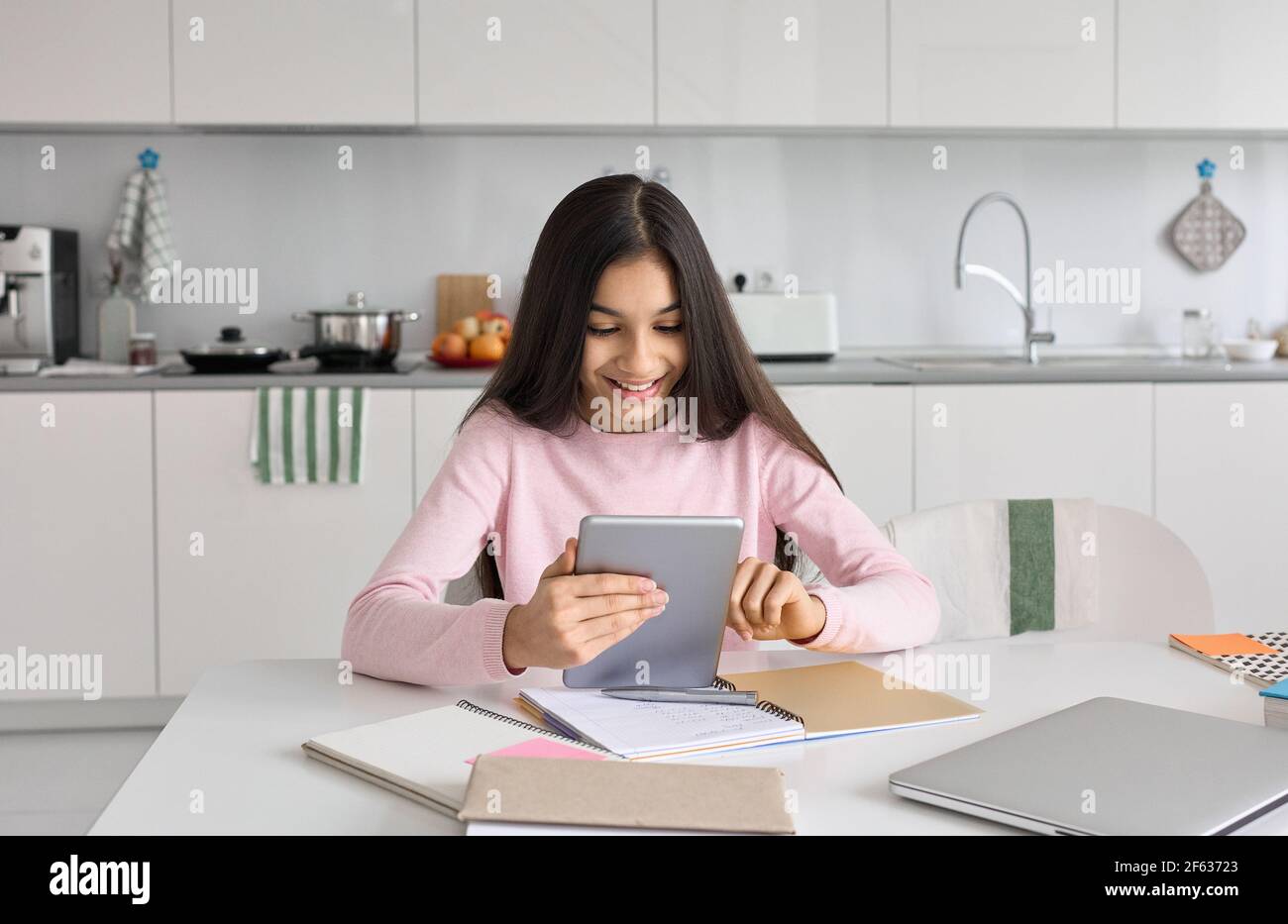 Indian school girl distance learning online at home using tablet Stock ...