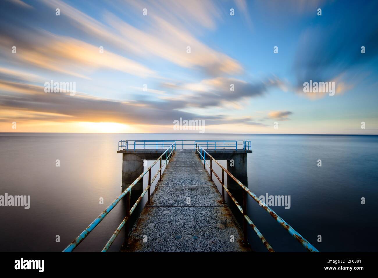 Jetty with railings leading into the sea, Madeira Stock Photo - Alamy