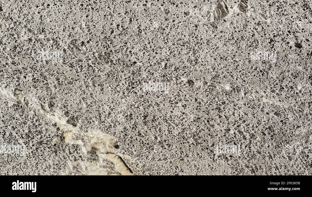 Natural background of Stone Granite Wall close-up, beige grey color ...