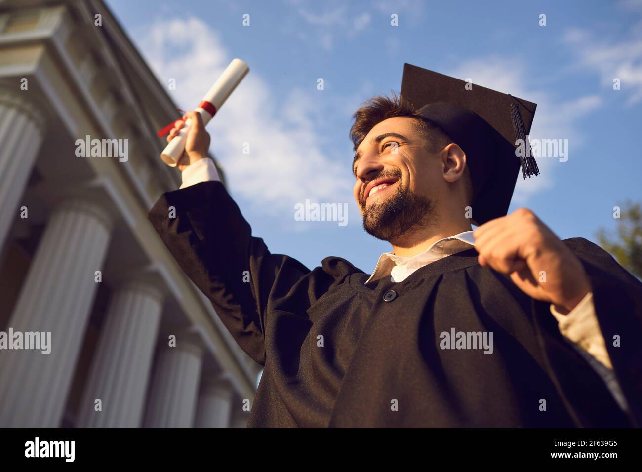 Man holding degree certificate hi-res stock photography and images - Alamy