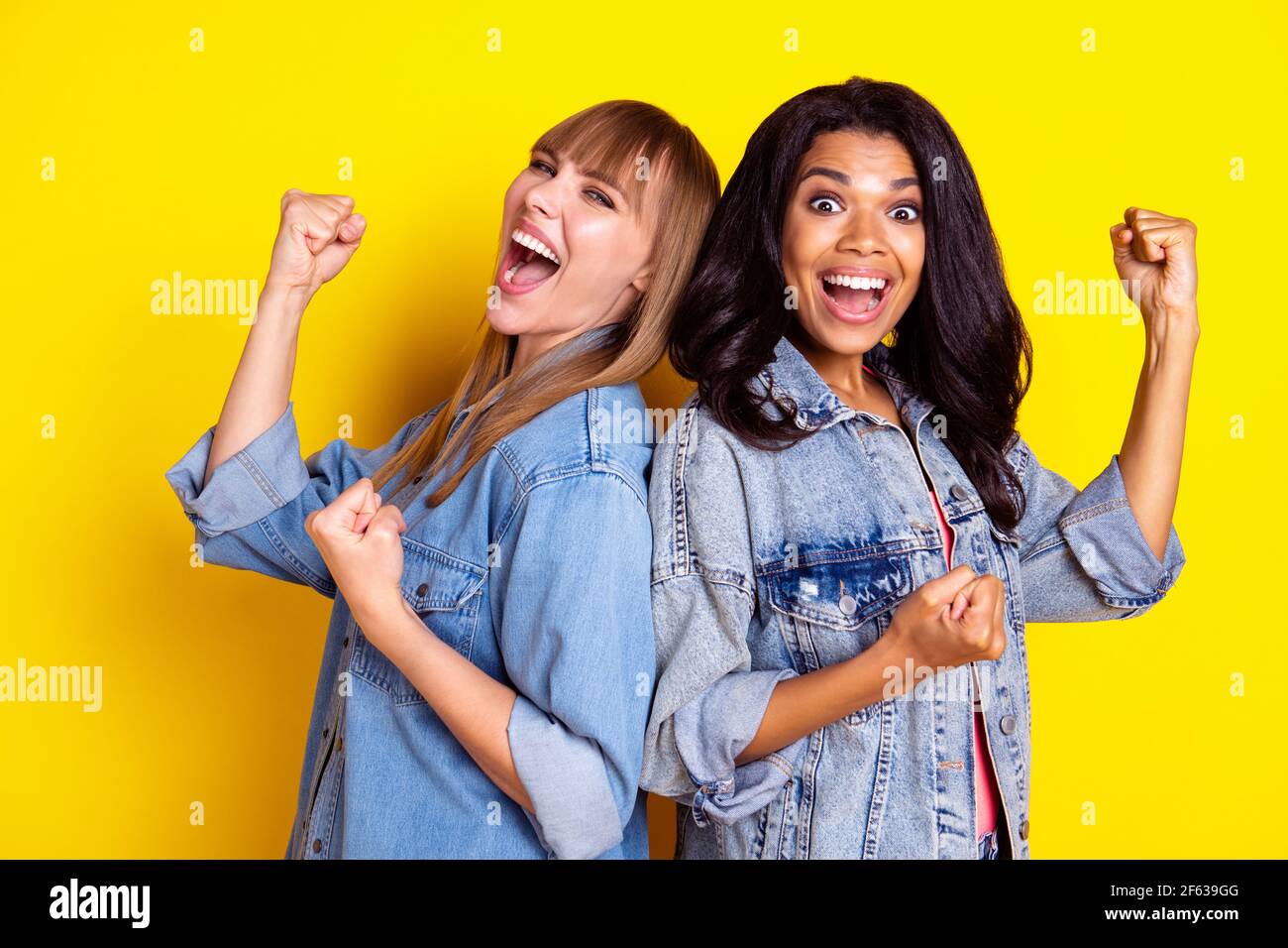 Photo of young happy excited crazy amazed girls hold fists in victory ...