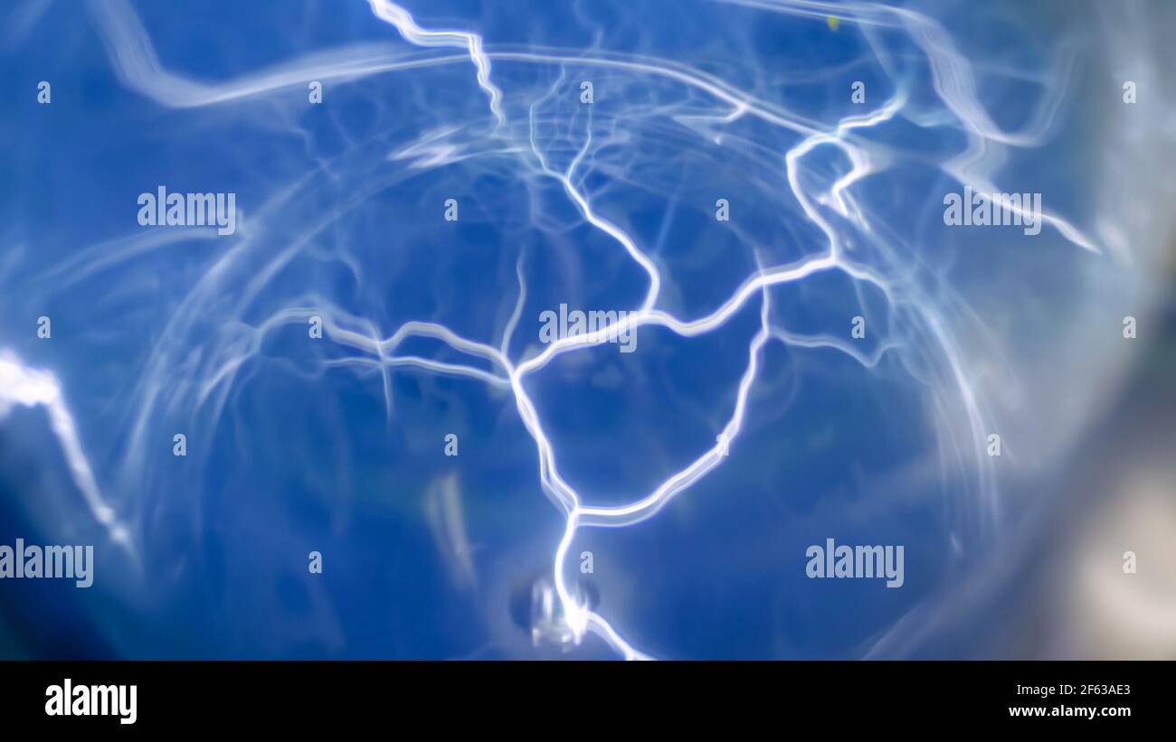 Plasma ball with many energy rays inside - close up Stock Photo - Alamy