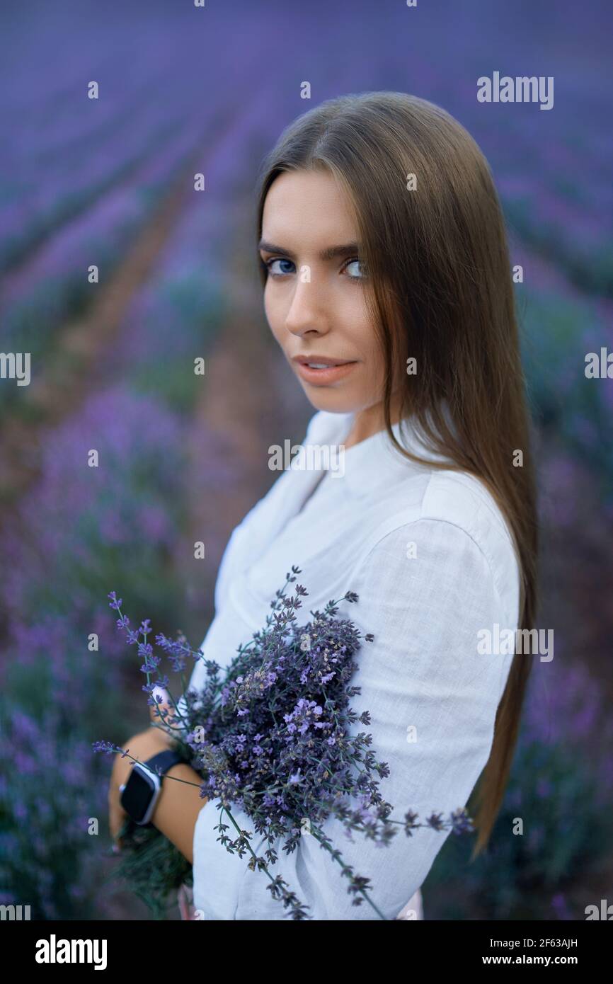 Portrait of pretty young female model wearing white shirt, summer ...