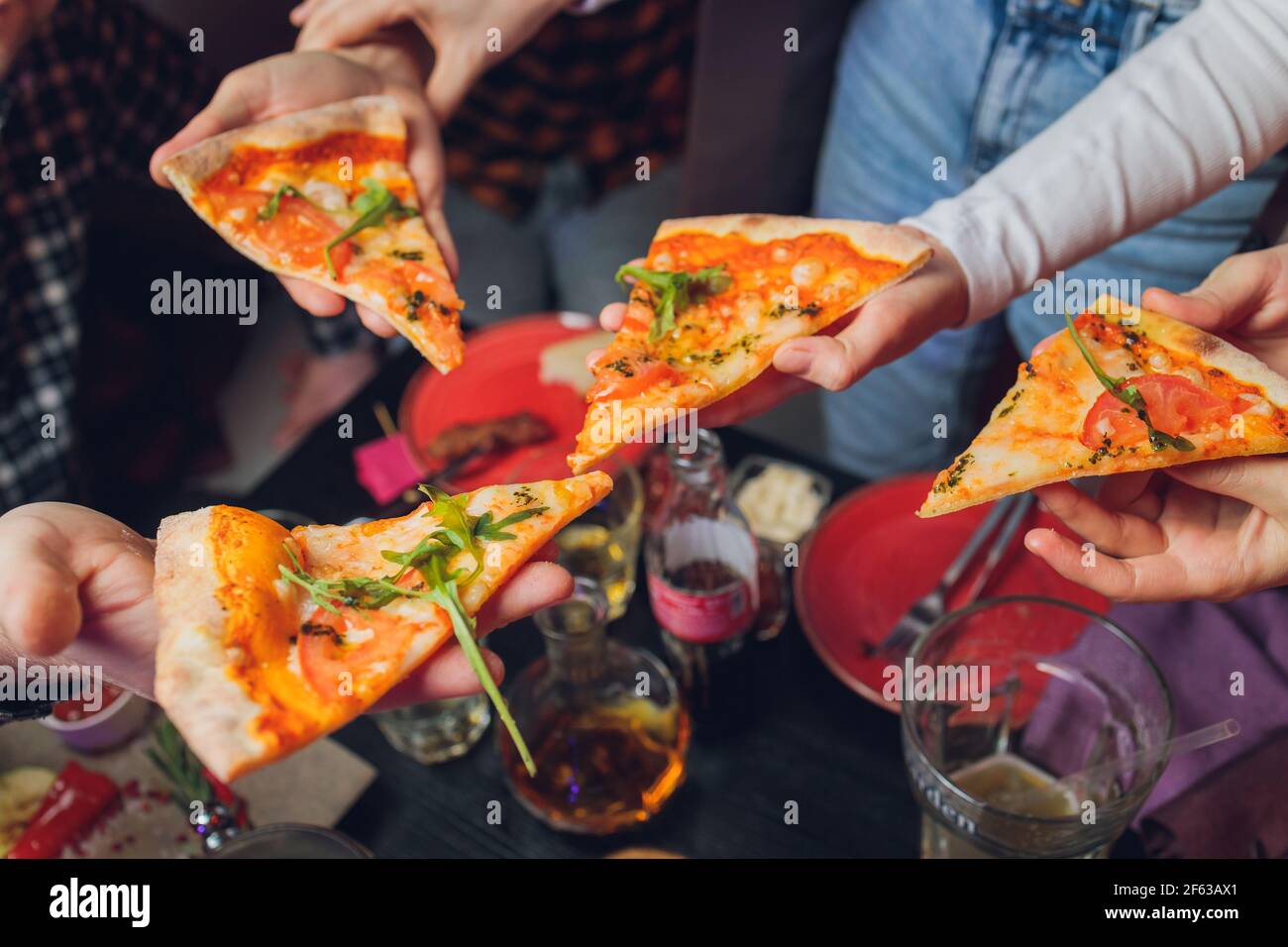 Eating Food Close Up Of People Hands Taking Slices Of Pepperoni Pizza