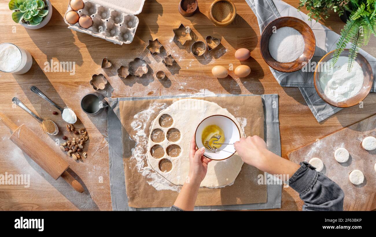 Top view of unrecognizable woman baking biscuits, desktop concept Stock ...
