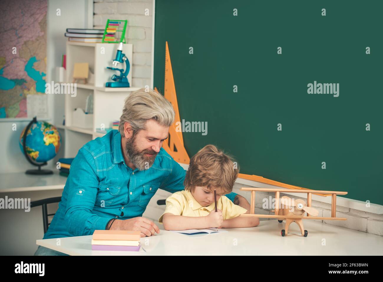 Private kids tutoring. Elementary school. Child home studying and home ...