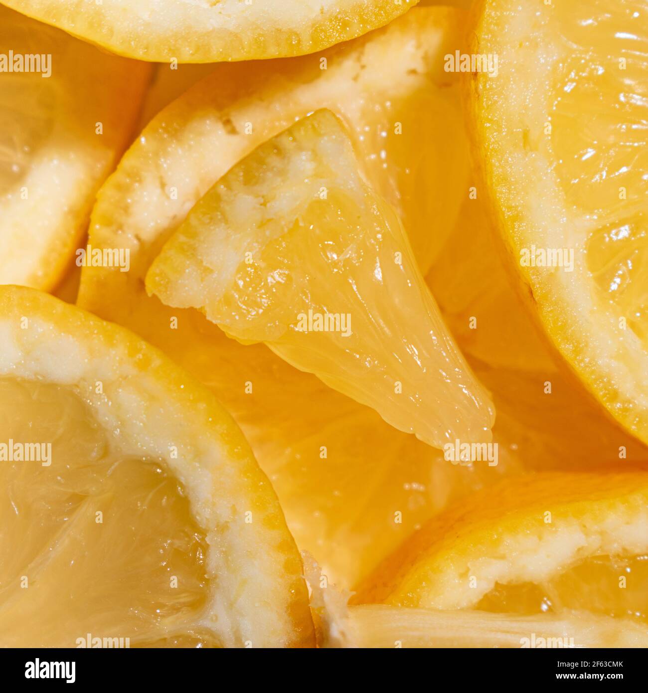 triangle-shaped slice of lemon surrounded by lemon slices Stock Photo ...