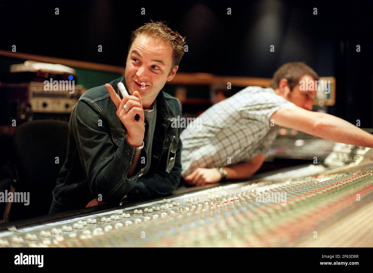 MICKEY GRAHAM FROM BOYZONE AT HIS RECORDING/MIXING DESK Stock Photo - Alamy