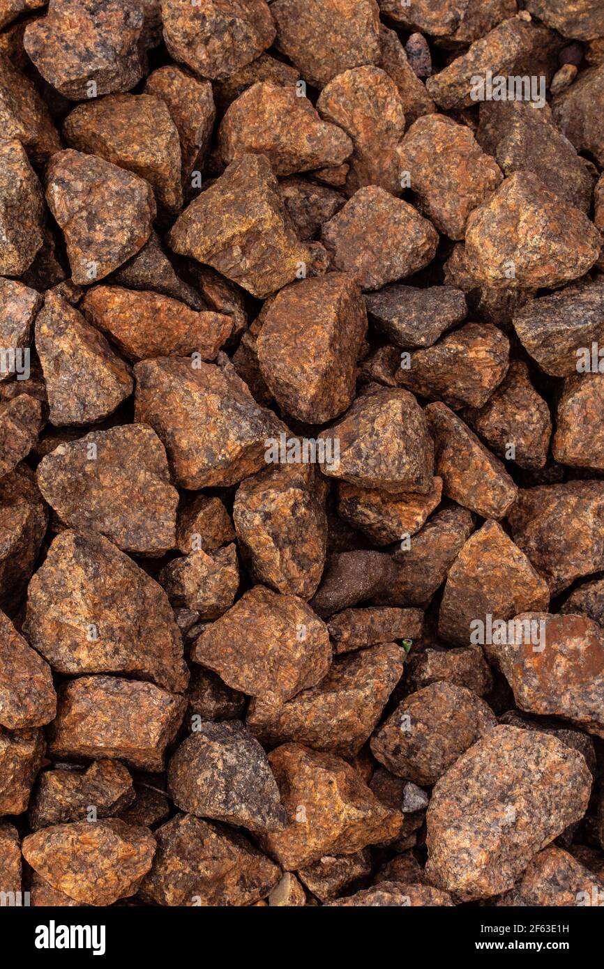 Big brown sharp stones background. Old rock stone Stock Photo - Alamy