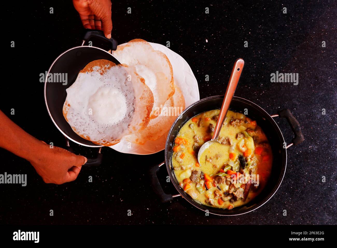 traditional kerala food speciality, appam and stew known as crispy rice ...