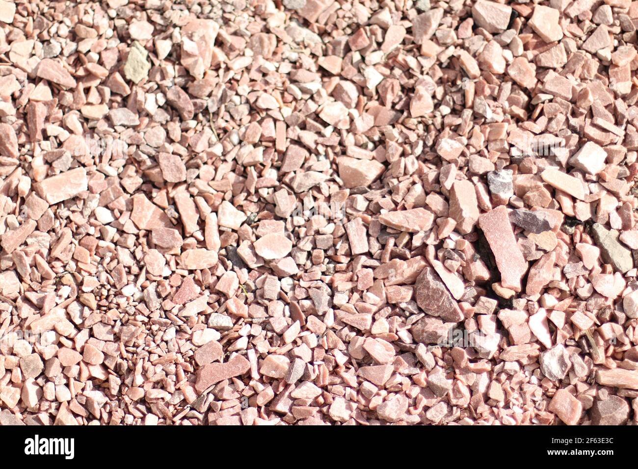 Small brown pebbles stone wall texture background Stock Photo - Alamy