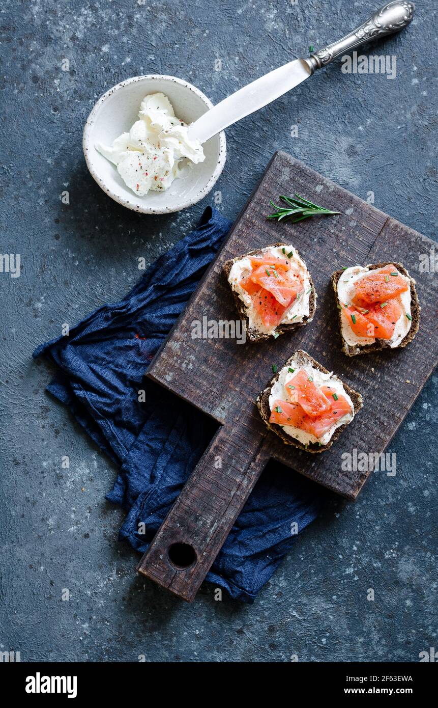 Healthy breakfast - toast with rye bread, salmon and cream cheese on ...