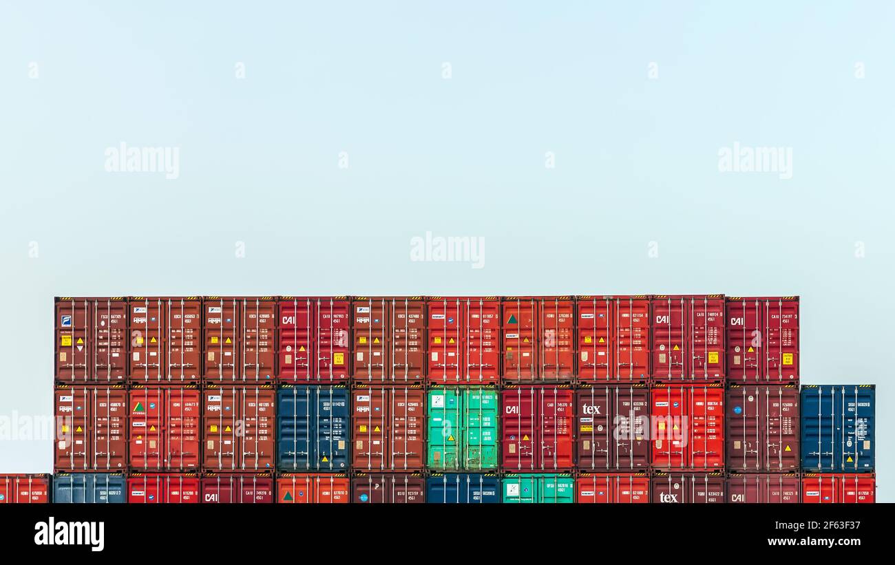 Shipping containers stacked on cargo Ship sailing through Suez Canal ...